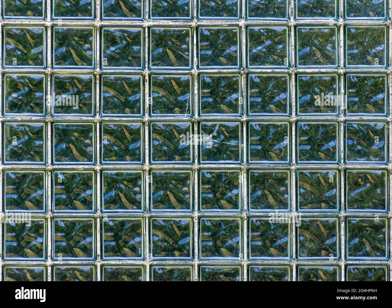 background of old glass brick wall texture surface made of dark glass ...