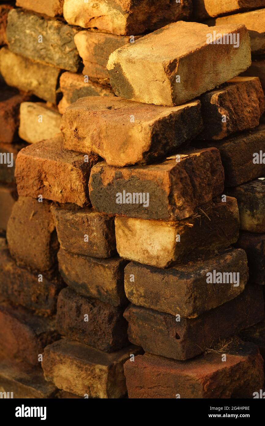Stack with old brown bricks Stock Photo - Alamy