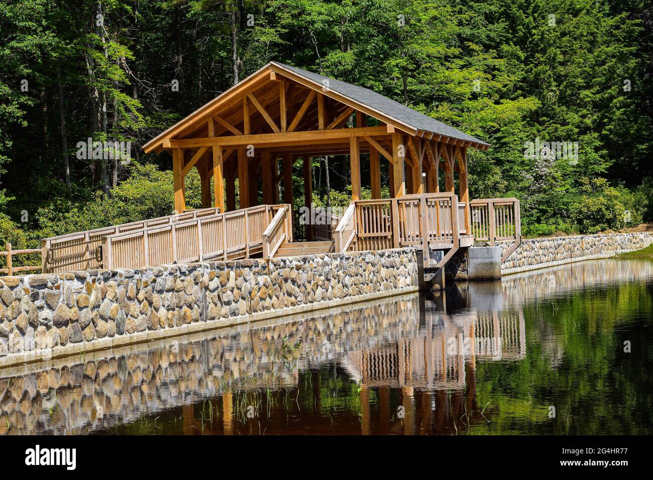 a foot bridge spanning a dam at eames pond at moore state park Stock ...