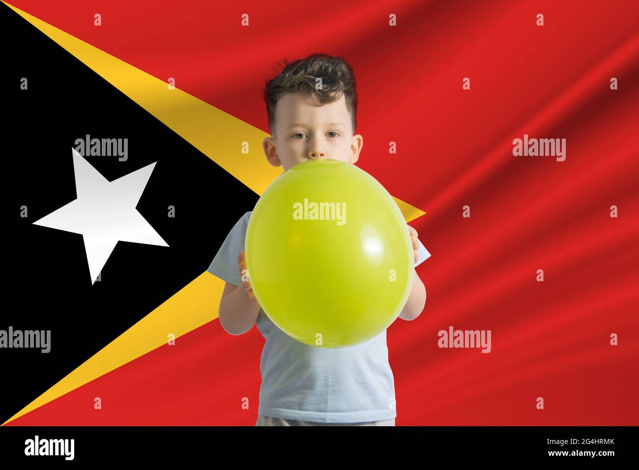 Children's day in East Timor. White boy with a balloon on the ...