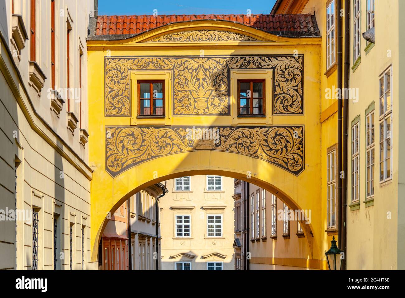 Old historical footbridge between two buildings in Prague Stock Photo ...