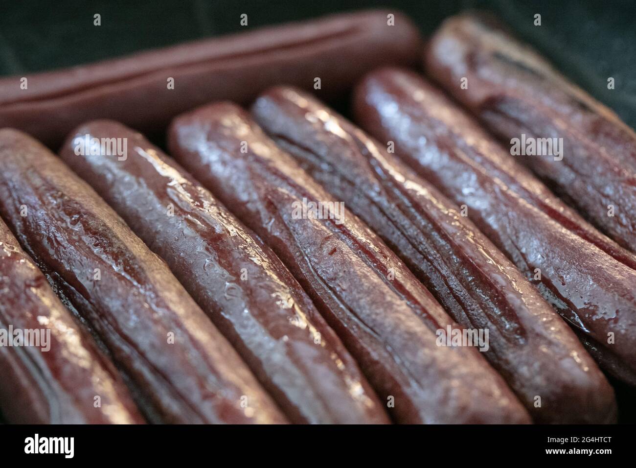 Close-up view of fried sausages. Meat fish. Cooking food Stock Photo ...