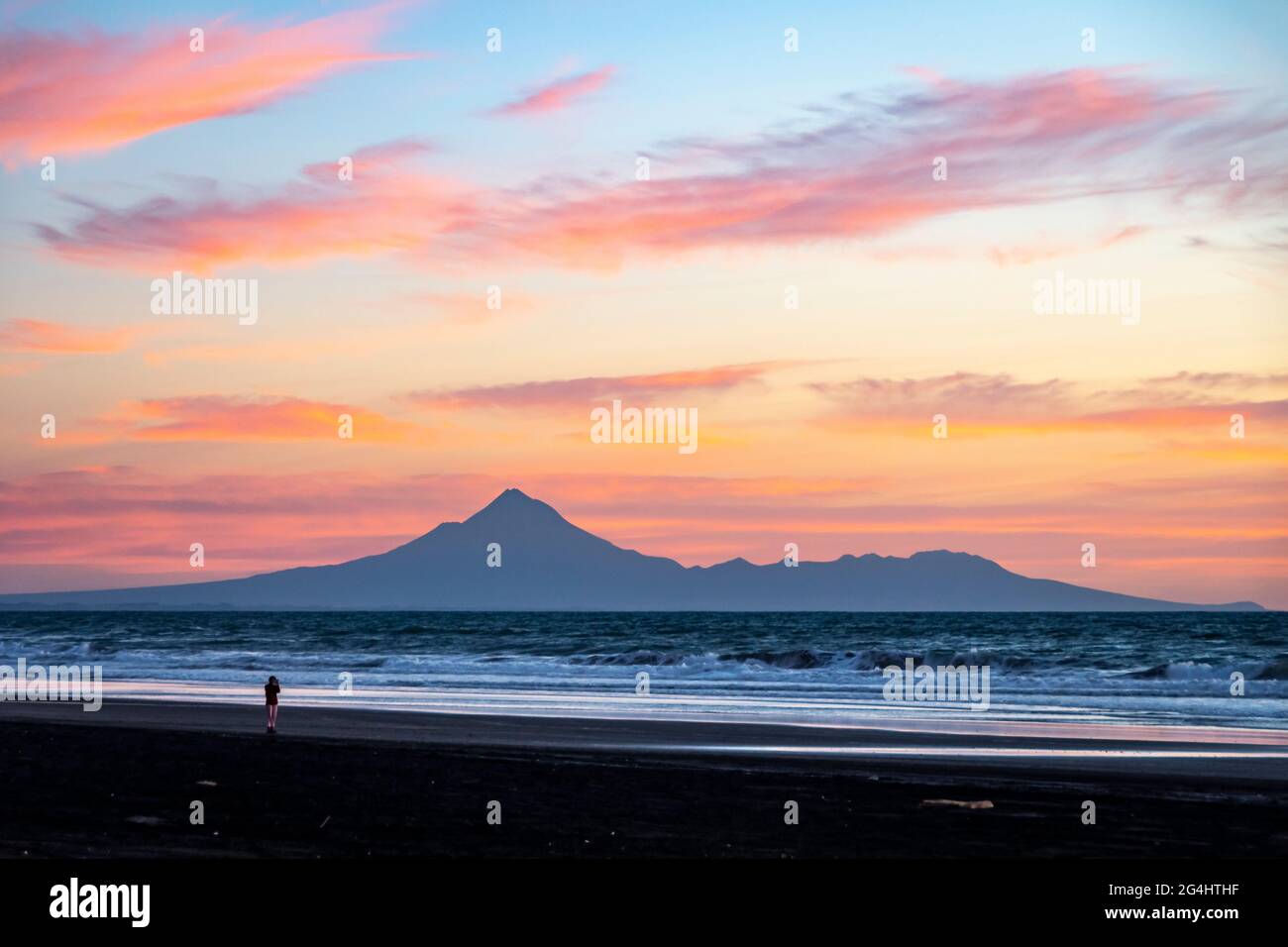 Sunset behind Mount Taranaki, from Awakino Beach, Waikato, North Island ...