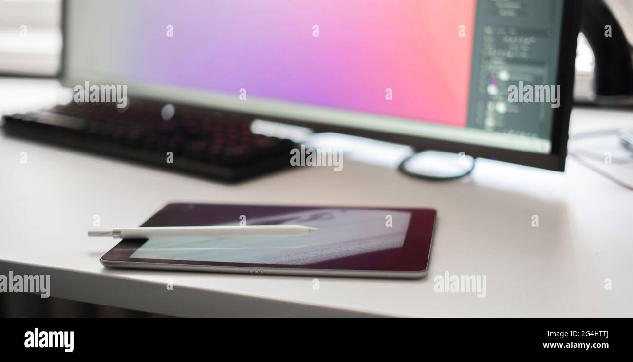 a huge computer monitor touch screen and pencil, a digital artist work ...