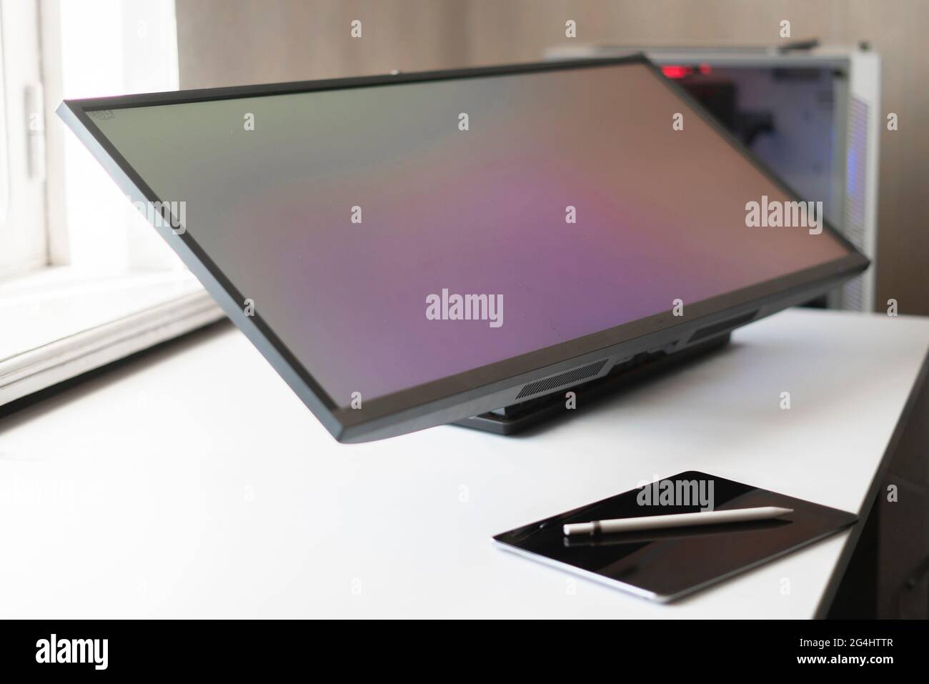 a huge computer monitor touch screen and pencil, a digital artist work ...