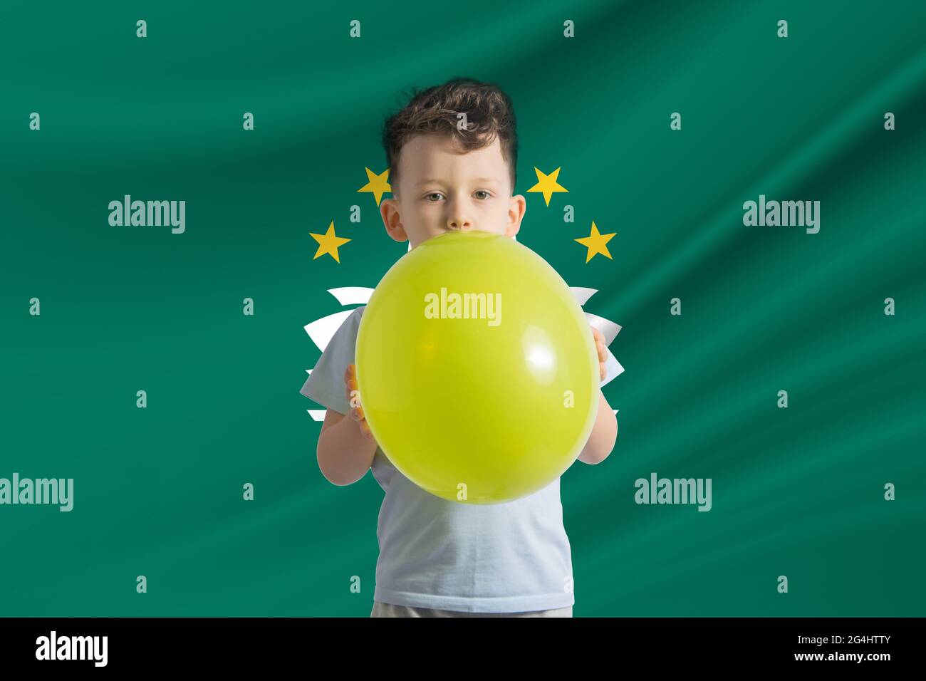 Children's day in Macau. White boy with a balloon on the background of ...