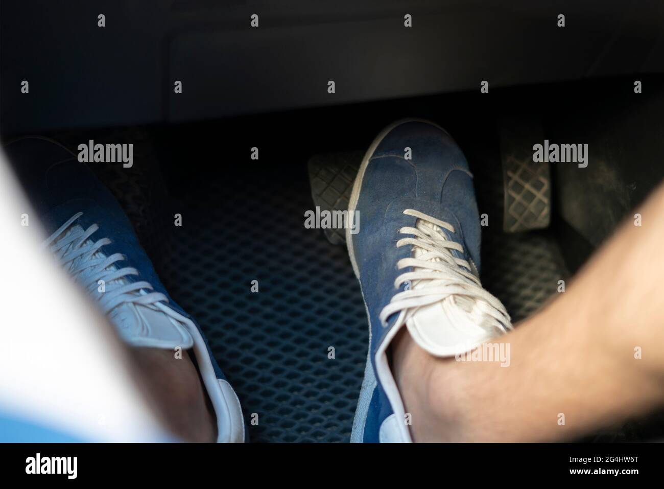 male driver feet push he pedals inside the car cockpit Stock Photo - Alamy