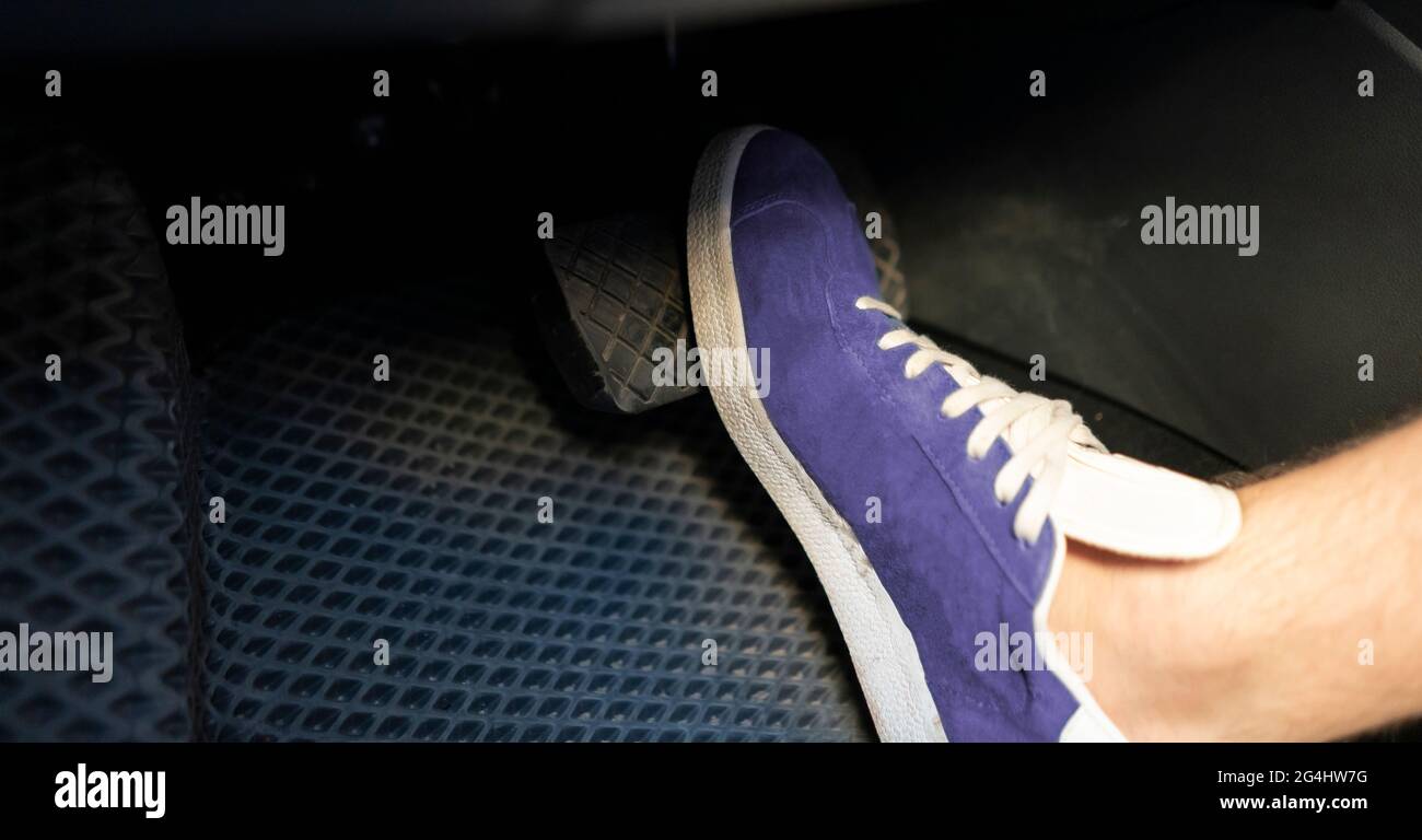 male driver feet push he pedals inside the car cockpit Stock Photo - Alamy