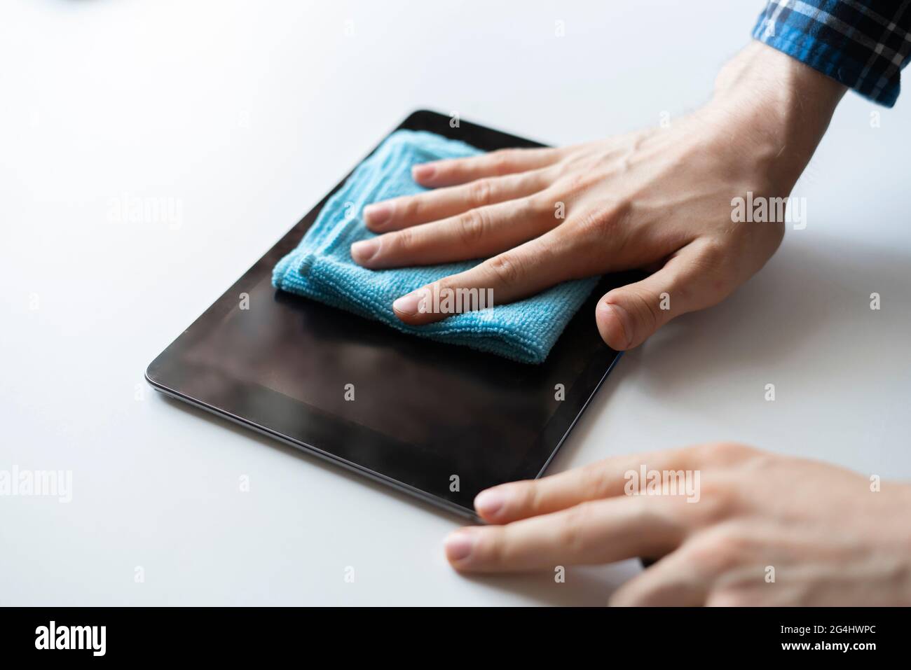 hand holding a rag and wipe a digital monitor screen of device Stock ...