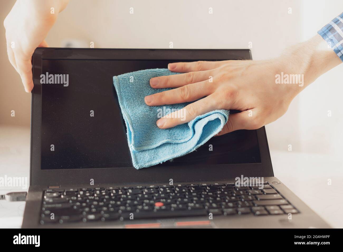 hand holding a rag and wipe a digital monitor screen of device Stock ...