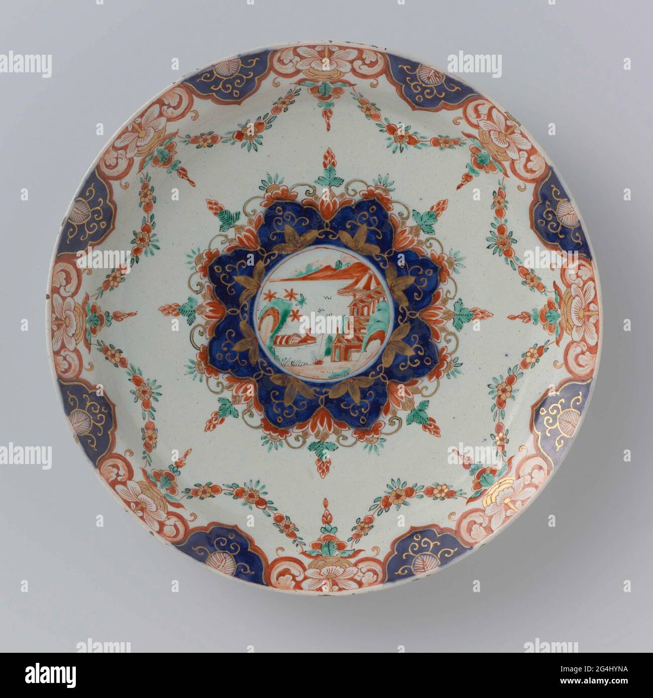 . Plate of Faïence. Multicolored painted with a Chinese water landscape ...