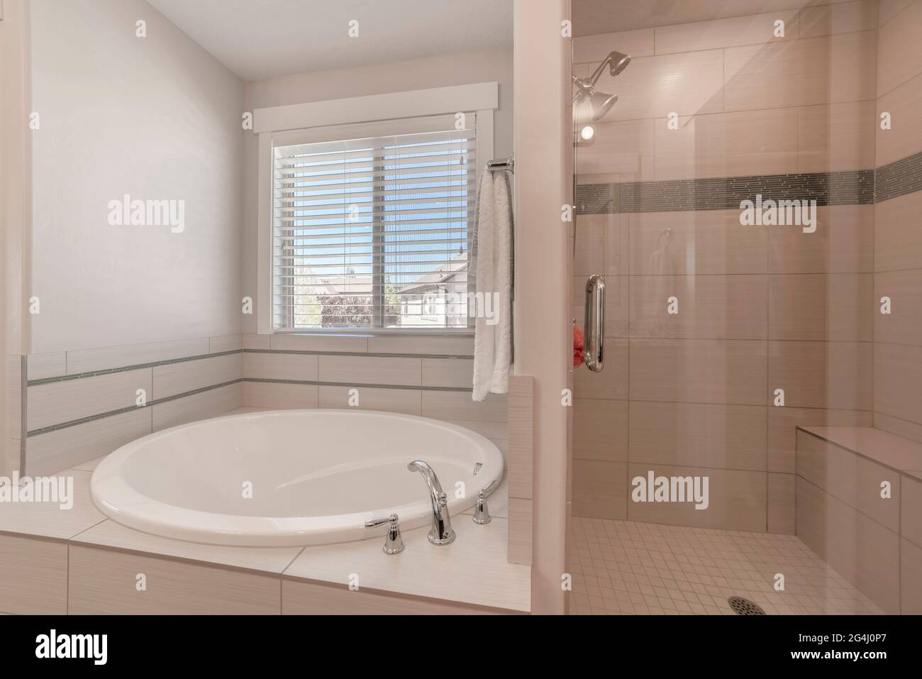 A bath and a shower cubicle in a bathroom Stock Photo - Alamy