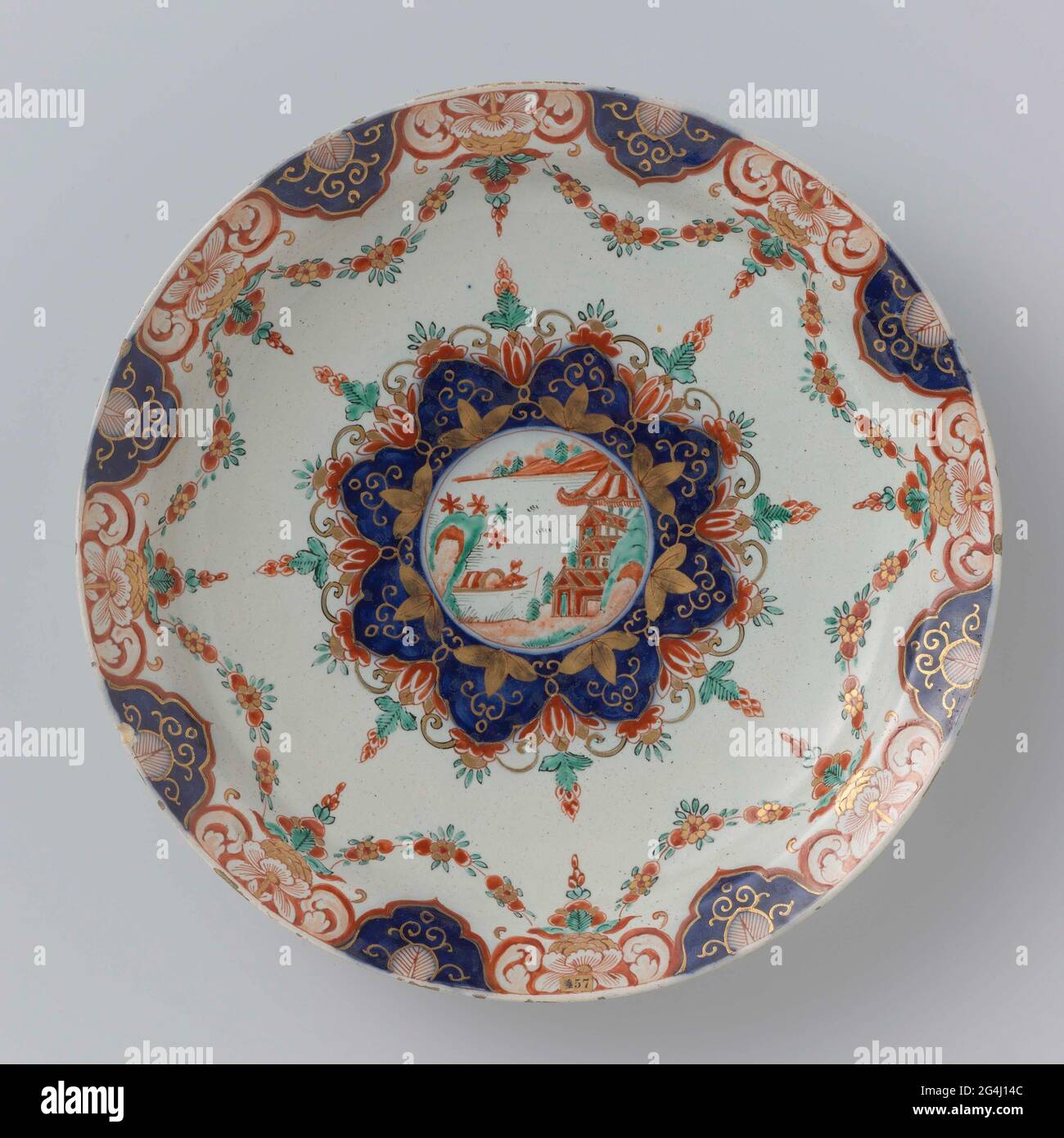 . Plate of Faïence. Multicolored painted with a Chinese water landscape ...