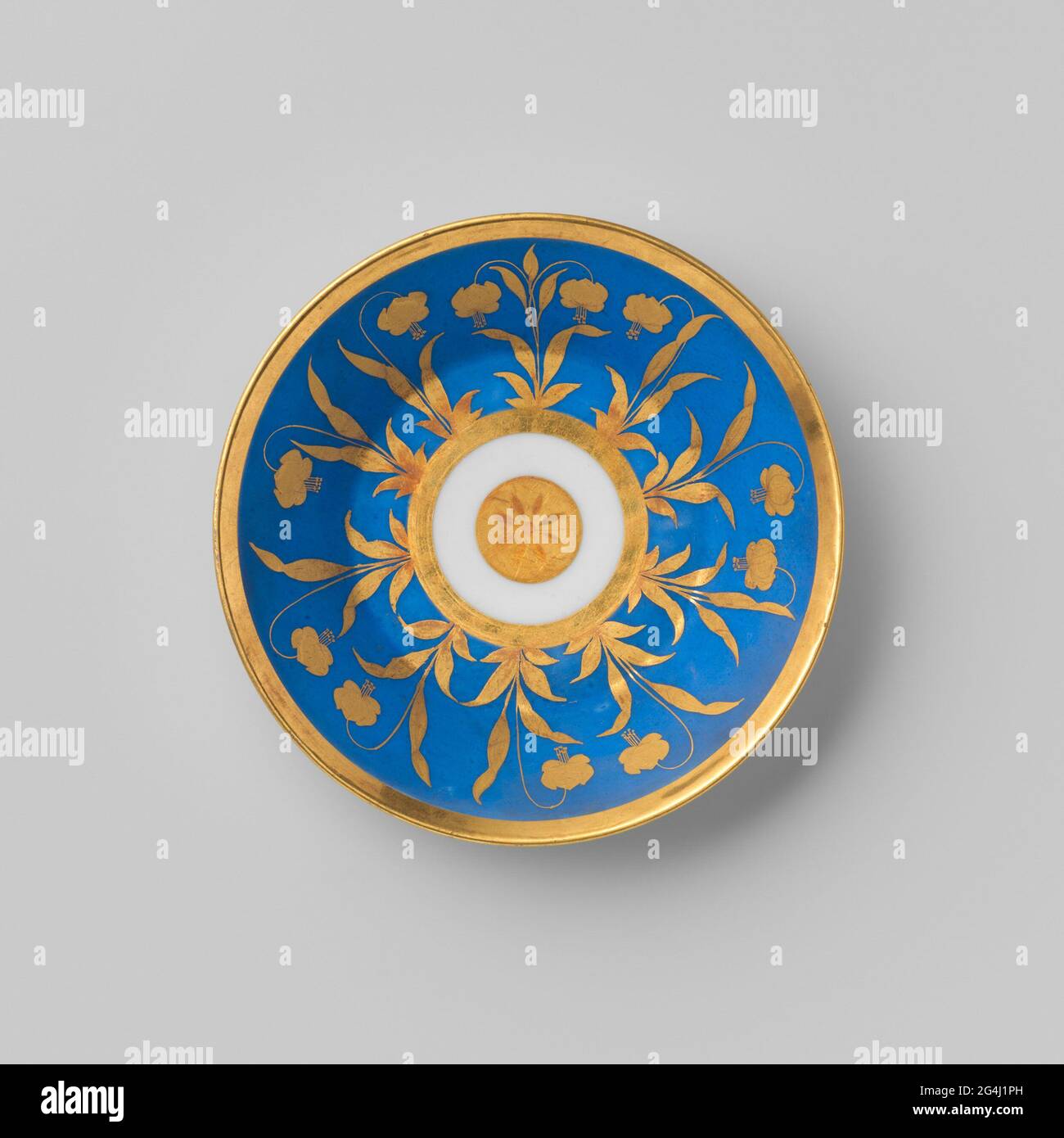 Dish, decorated with golden flowers. Dish of porcelain, decorated with ...