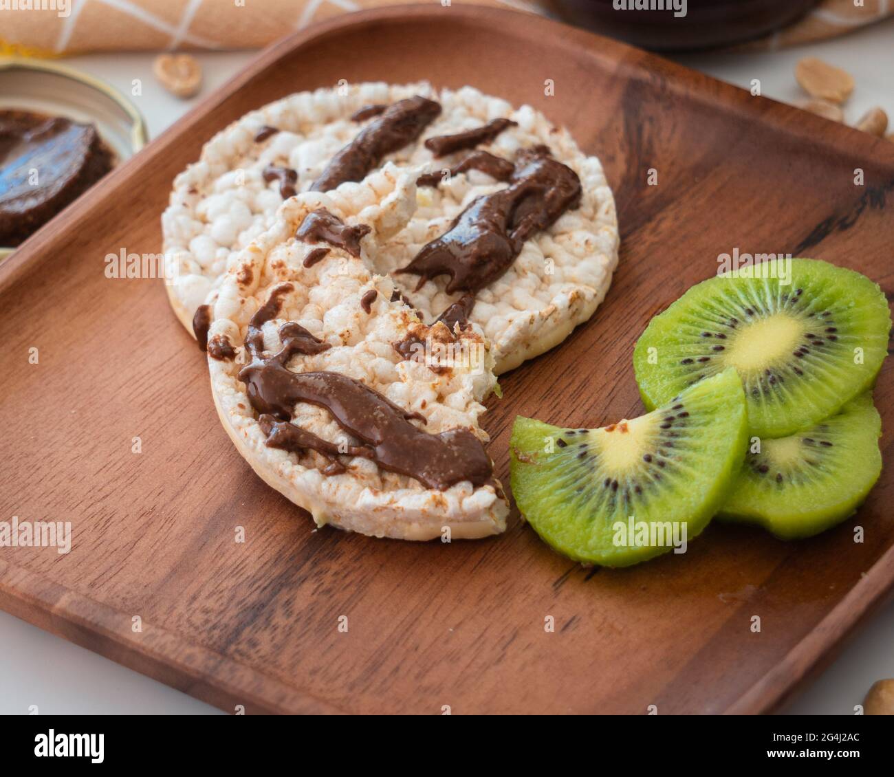 Rice crackers with peanut butter and chocolate-flavored cocoa ...