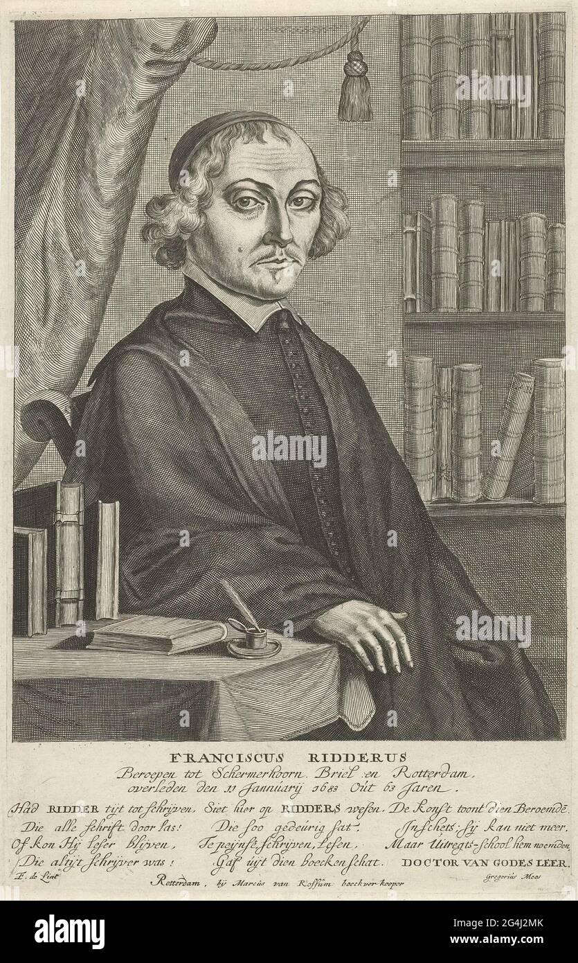 . Franciscus knight's hand, pastor, standing at a table with books and ...