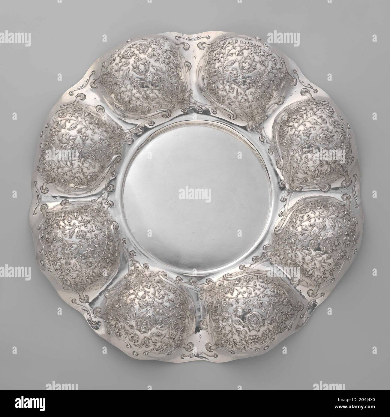 . Scale of silver. Walled edge, decorated with lobe ornament and flower ...