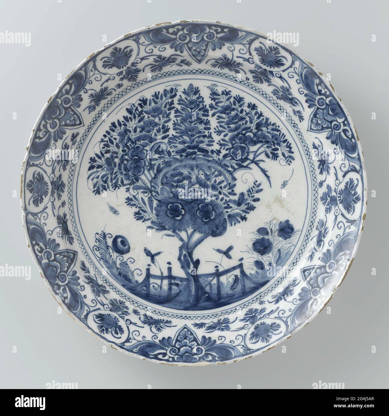 . Dish of Faience. Blue painted with a fantasy tree Stock Photo - Alamy