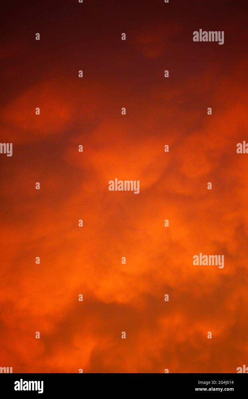 Fiery Sunset Sky with Clouds Stock Photo - Alamy