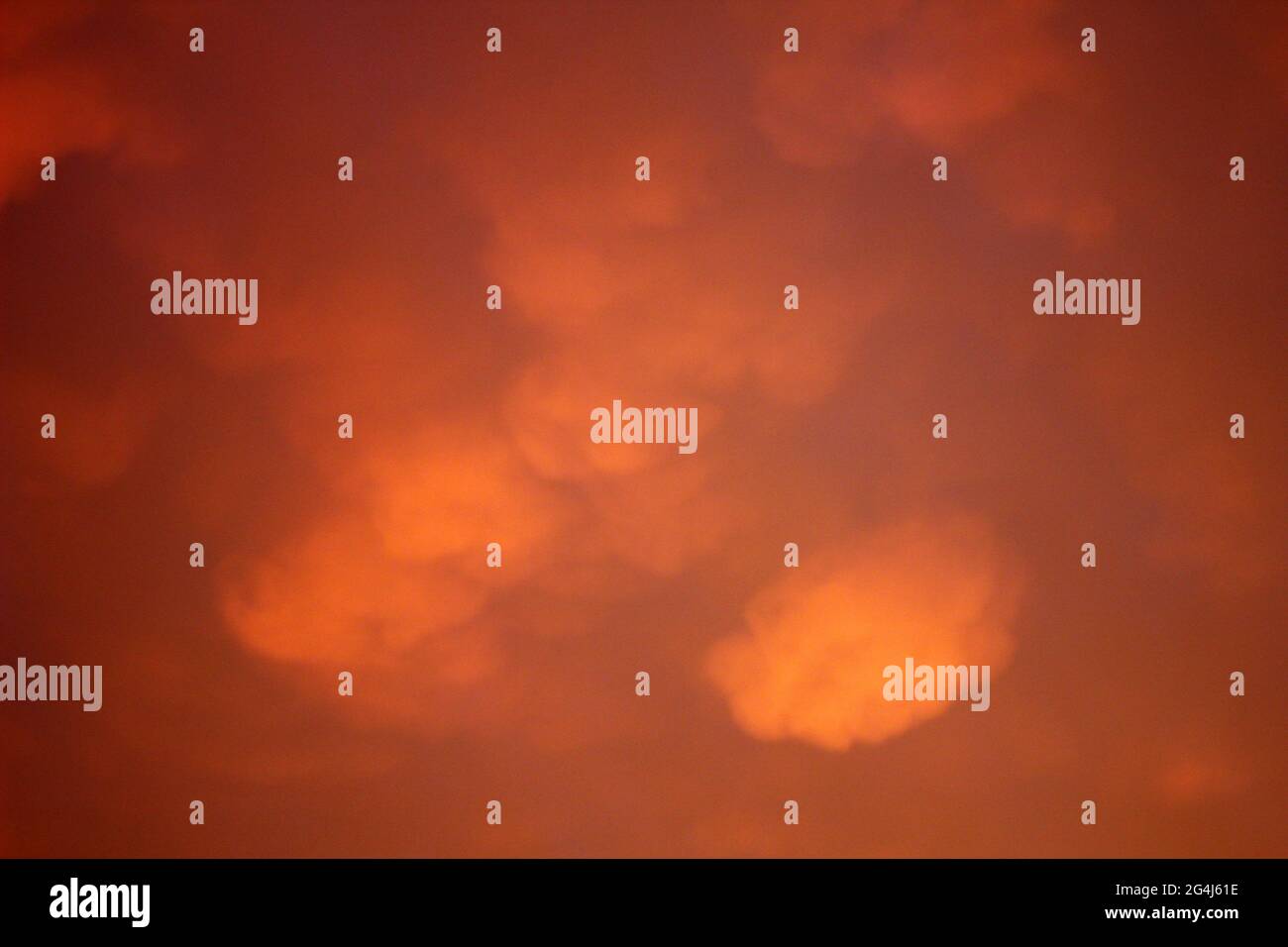 Fiery Sunset Sky with Clouds Stock Photo - Alamy