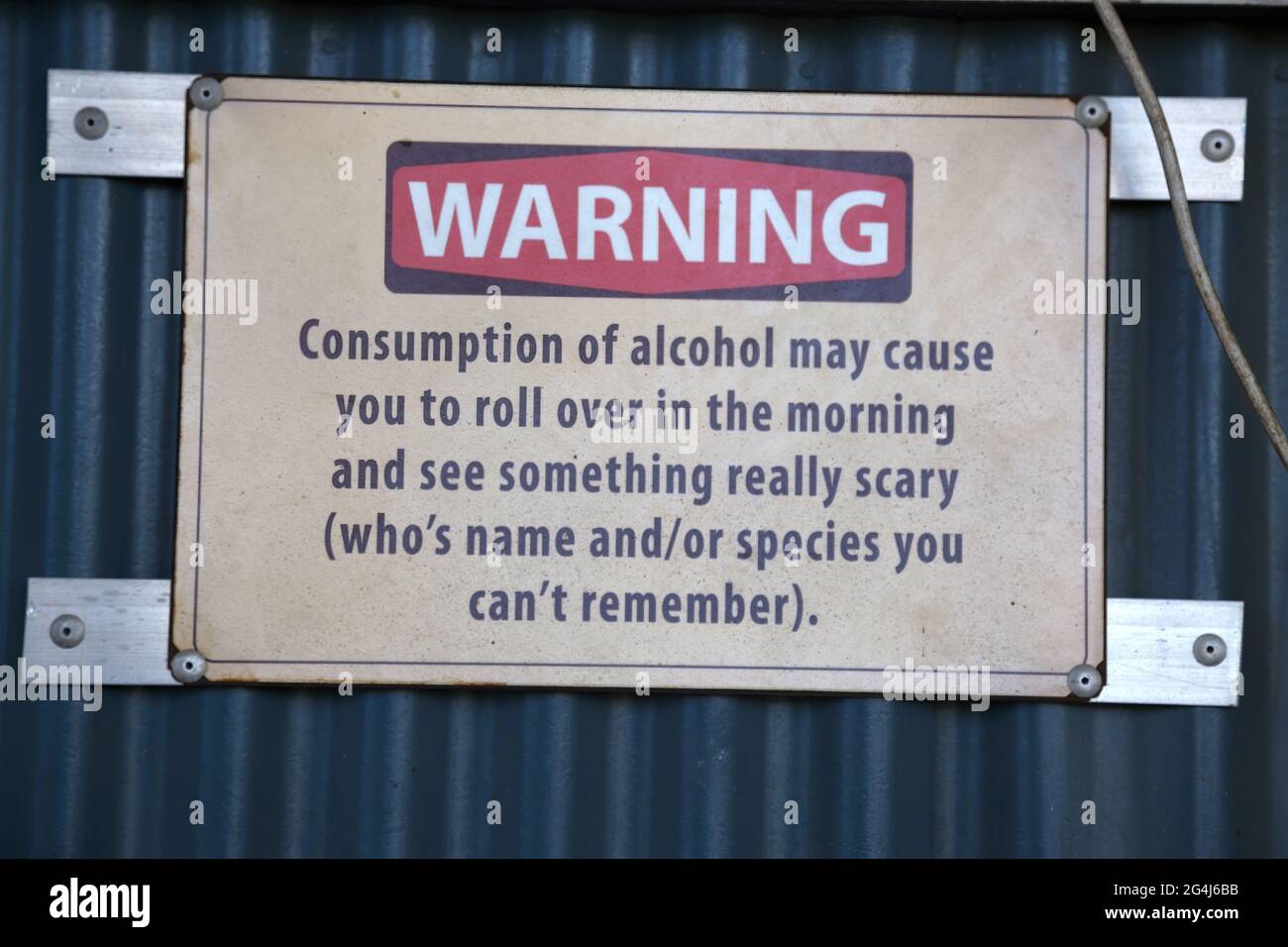 Funny sign on a metal wall near Mareeba in Tropical North Queensland ...