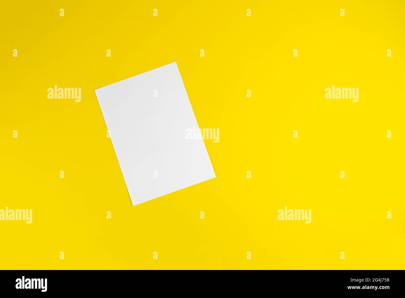 blank empty white paper sheet of a4 format on the table in office ...