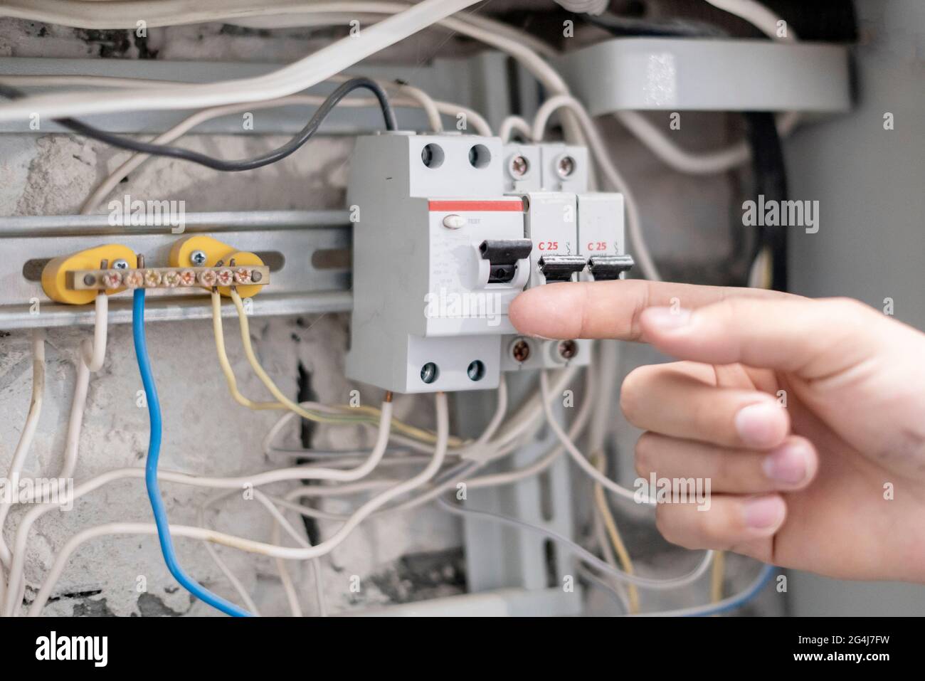 the professional electricity worker fixing the home lighting power ...