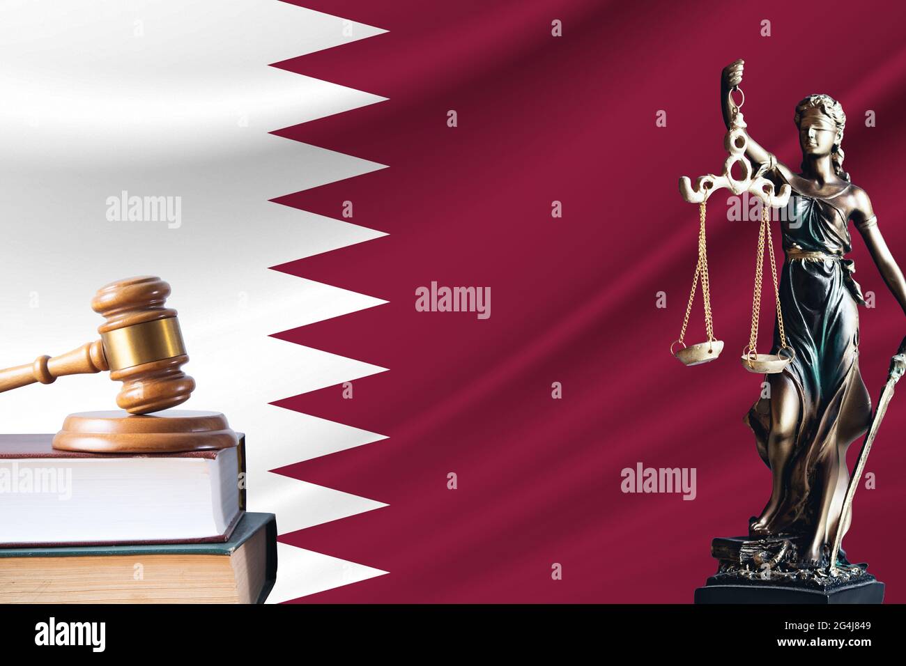 Law and justice in Qatar Statue of themis and the gavel of the judge ...
