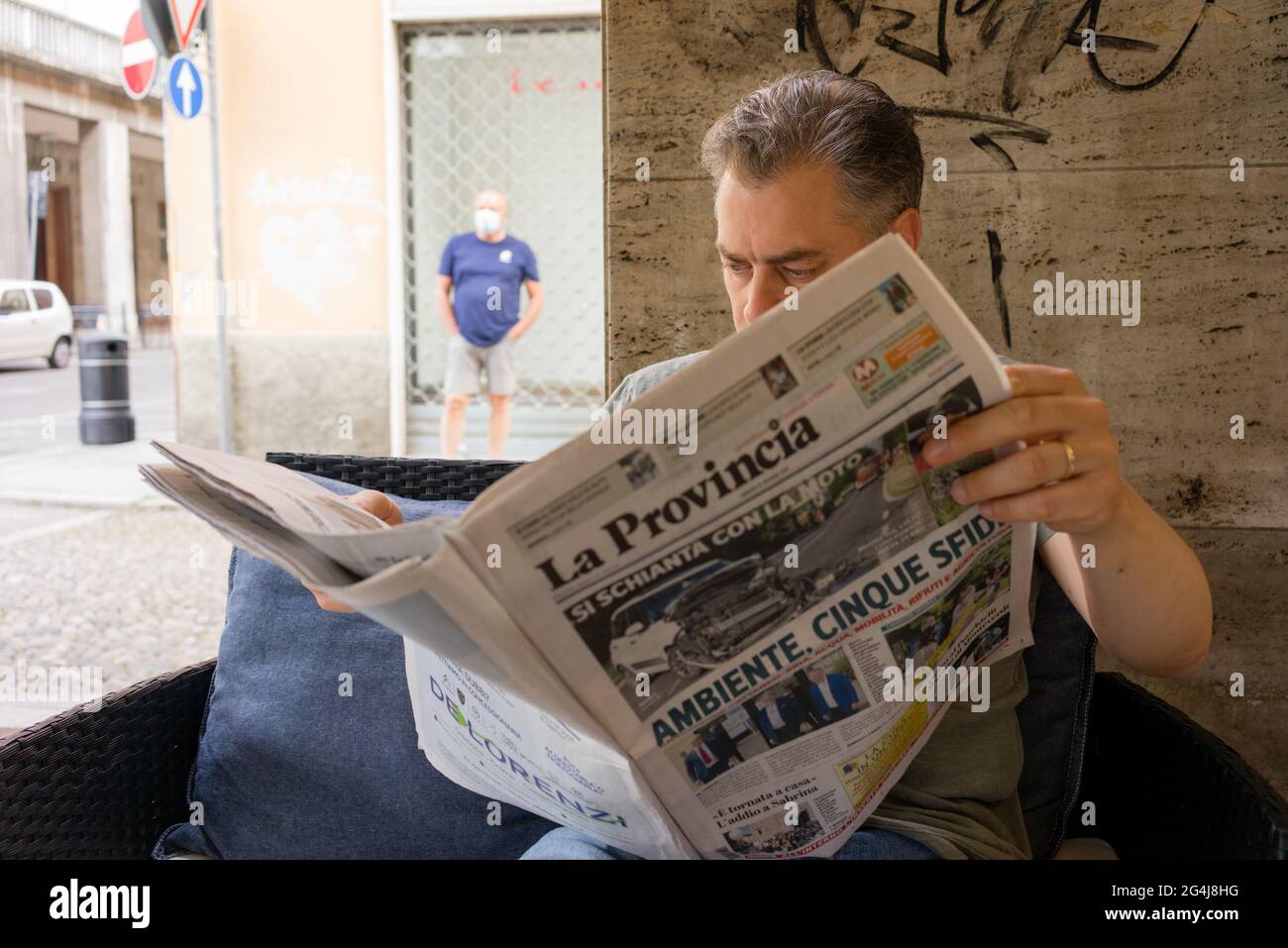 CREMONA, ITALY - Jun 19, 2021: adult caucasian italian man reading ...