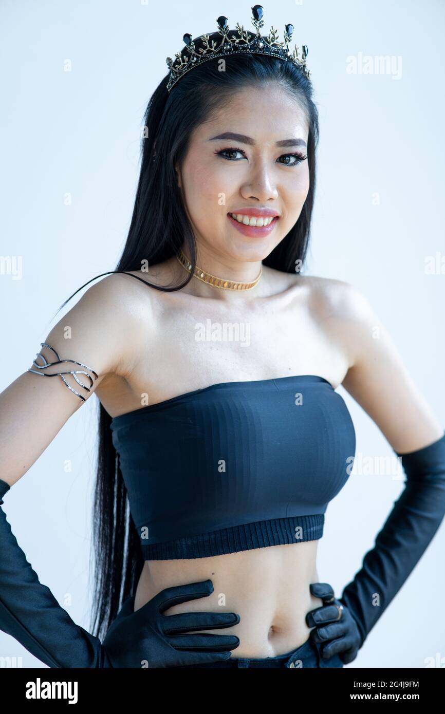 Dark hair asian girl wearing crown Stock Photo - Alamy