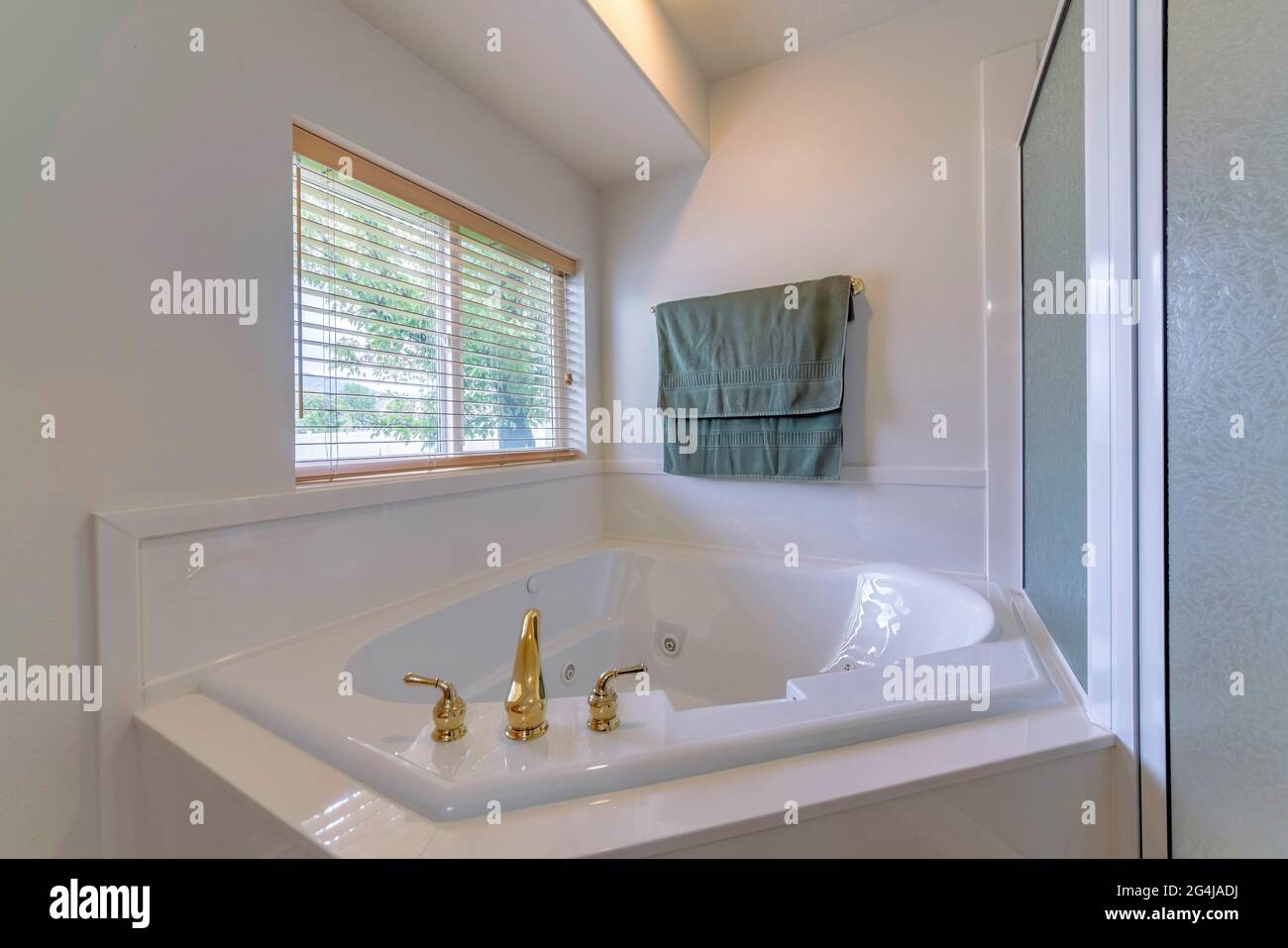 Small white bath in a bathroom Stock Photo - Alamy