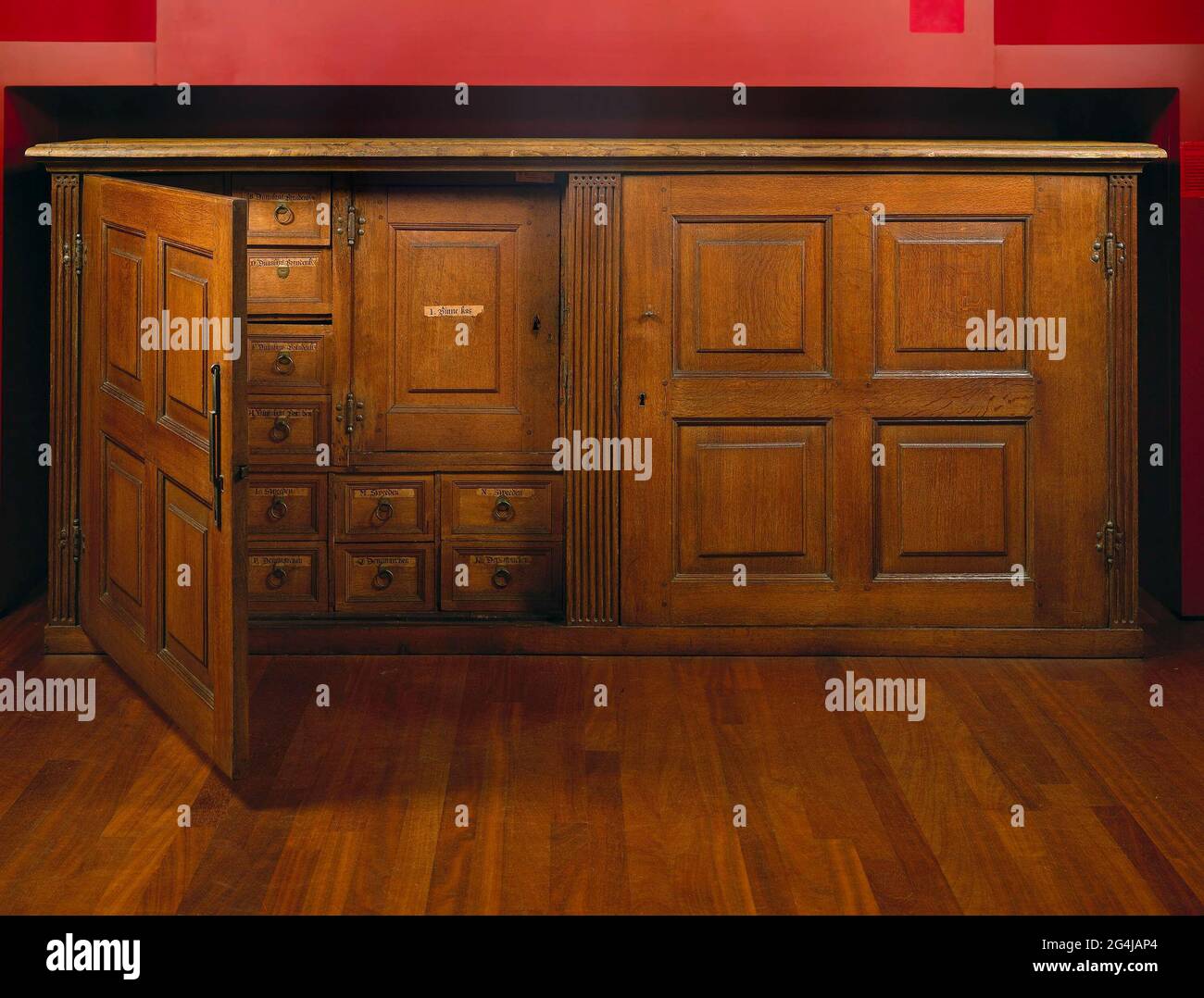 . Filing cabinet with two doors, each divided by framework in four ...
