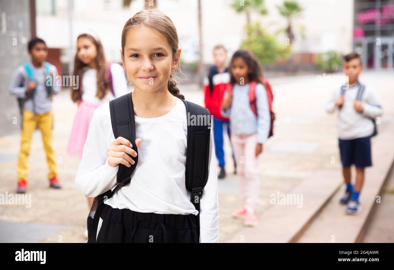 Smiling tween schoolgirl going to school on autumn day Stock Photo - Alamy