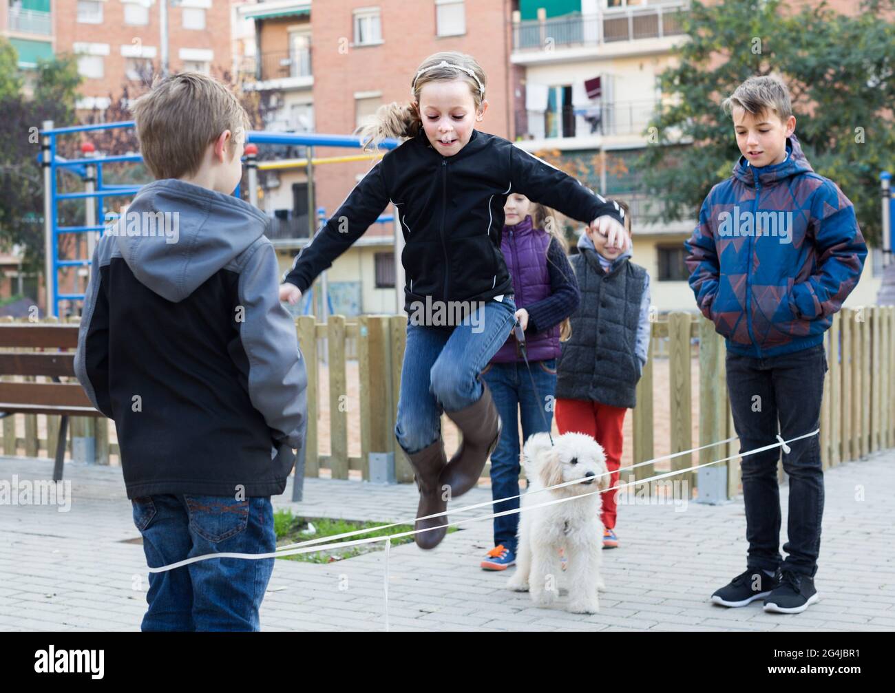 children playing rubber band Stock Photo - Alamy