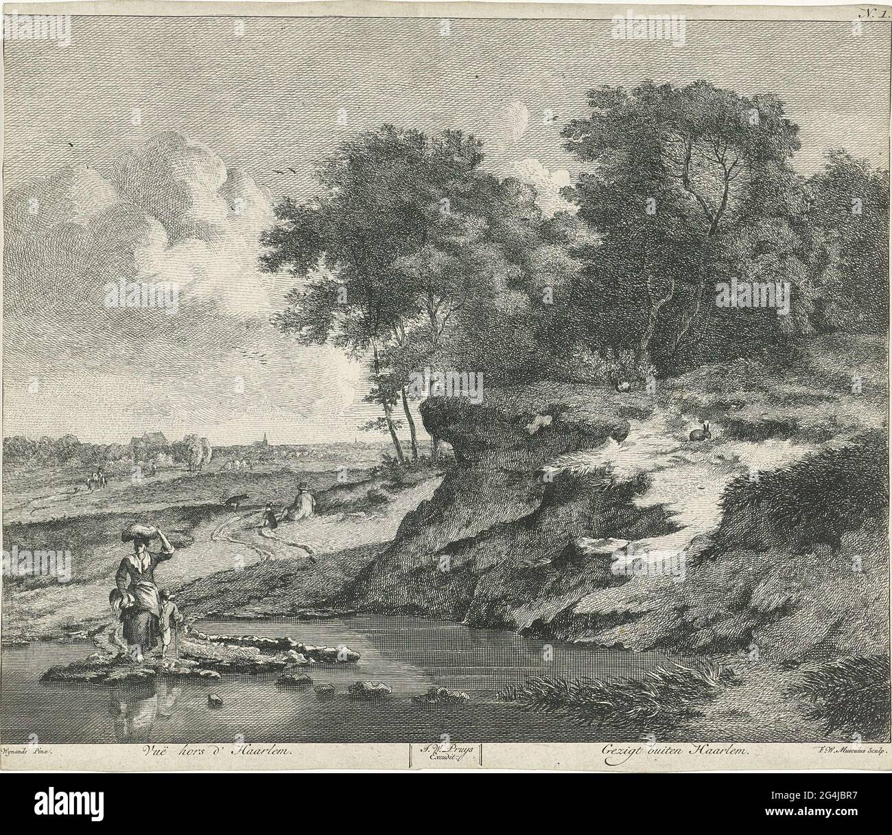 . In a dune landscape a woman walks with a suit on her head. On the ...