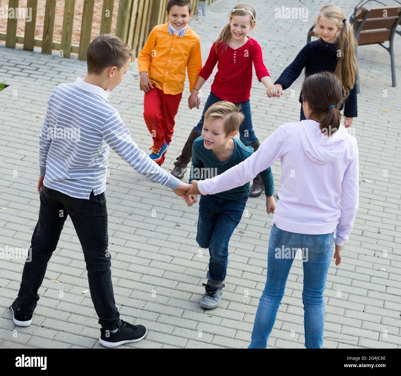 Happy children playing forcing the city gates Stock Photo - Alamy