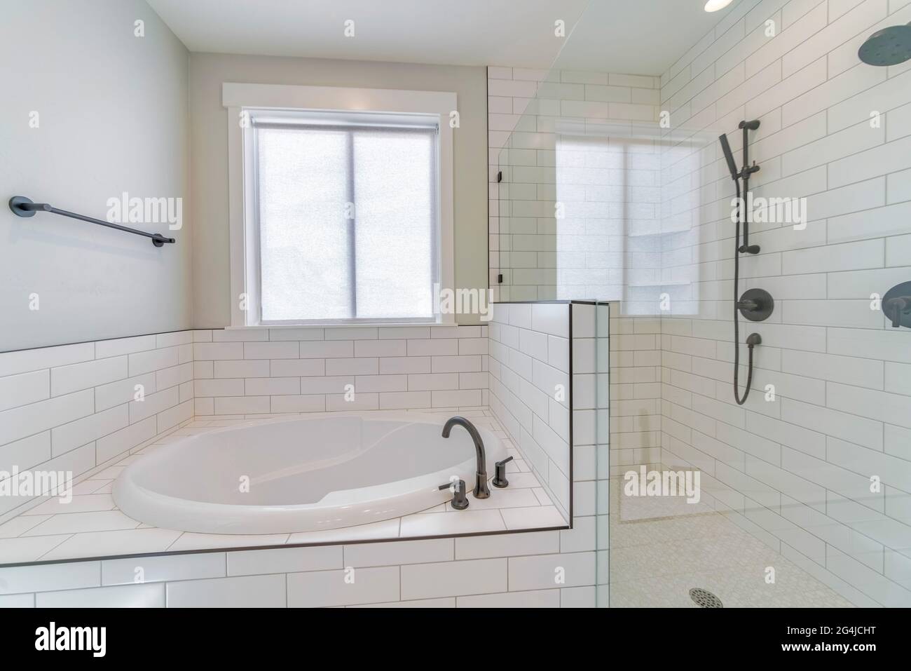 Bath and a shower cubicle in a bathroom Stock Photo - Alamy