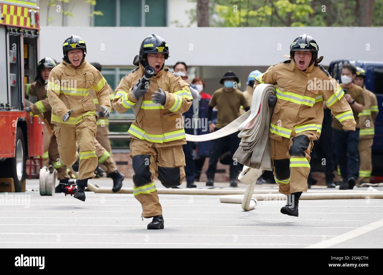 22nd June, 2021. Firefighters' contest Firefighters carrying a fire ...