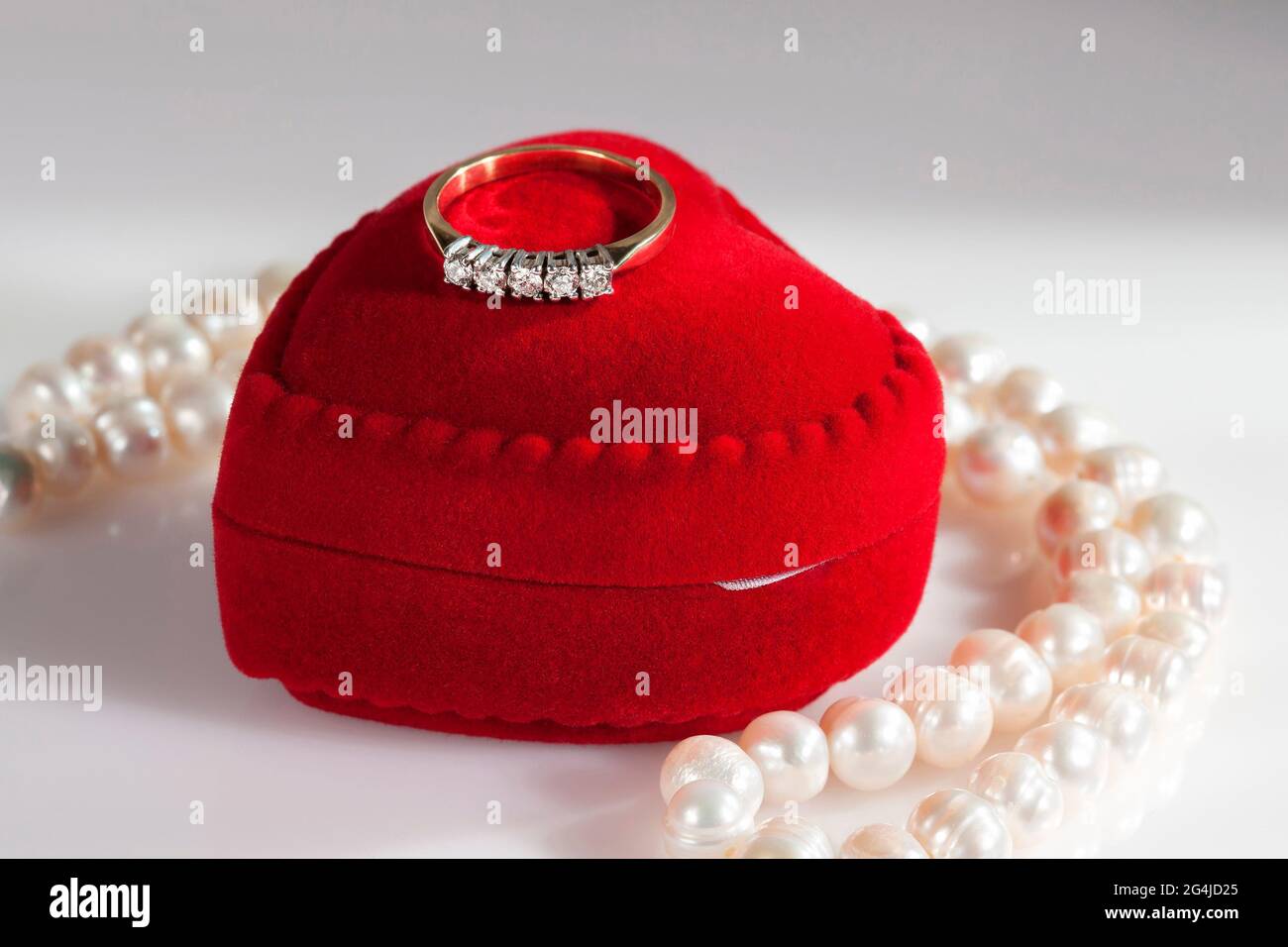 Diamond ring in a red box Stock Photo - Alamy