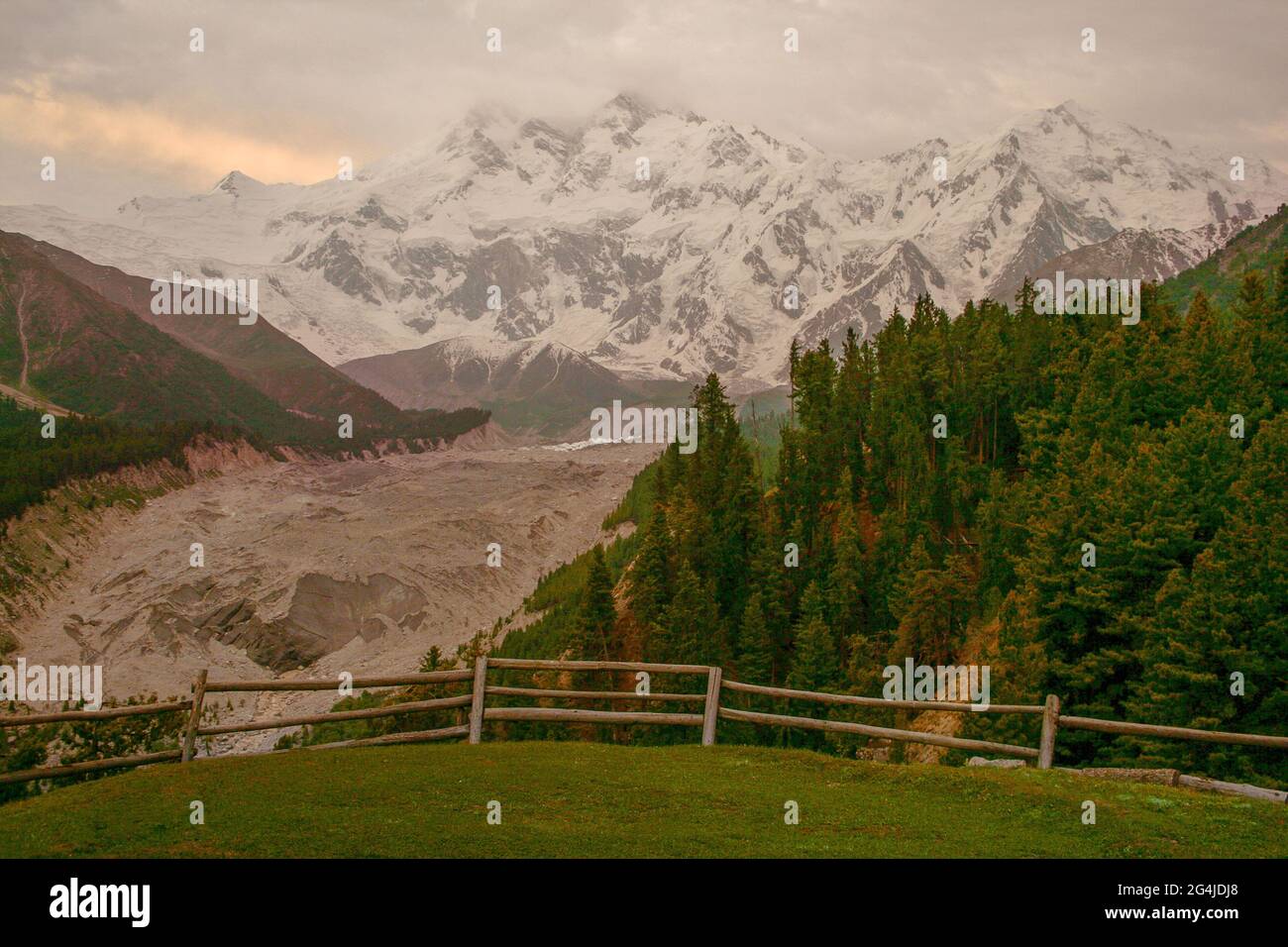 Mesmerizing country landscape with snowy mountains in the background ...