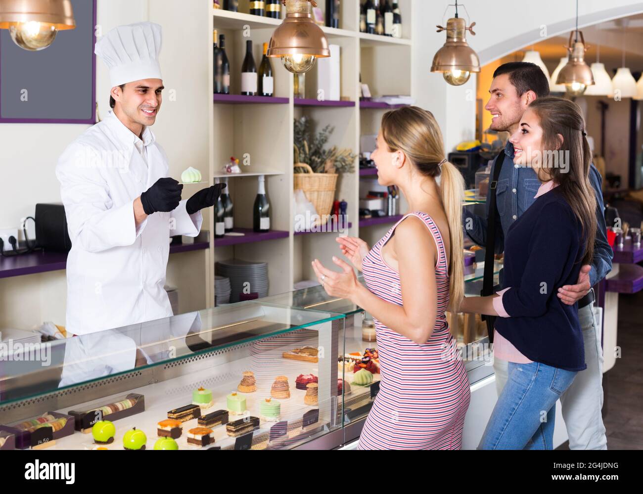 Positive young man baker hi-res stock photography and images - Alamy