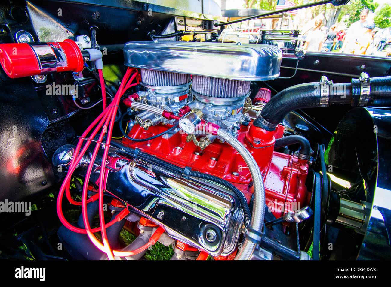 Closeup shot of a vehicle engine with red cables - technology Stock ...