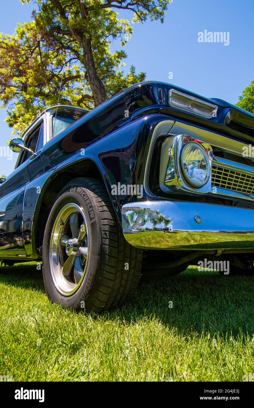 Low angle shot of a blue retro car with a round headlight standing on ...