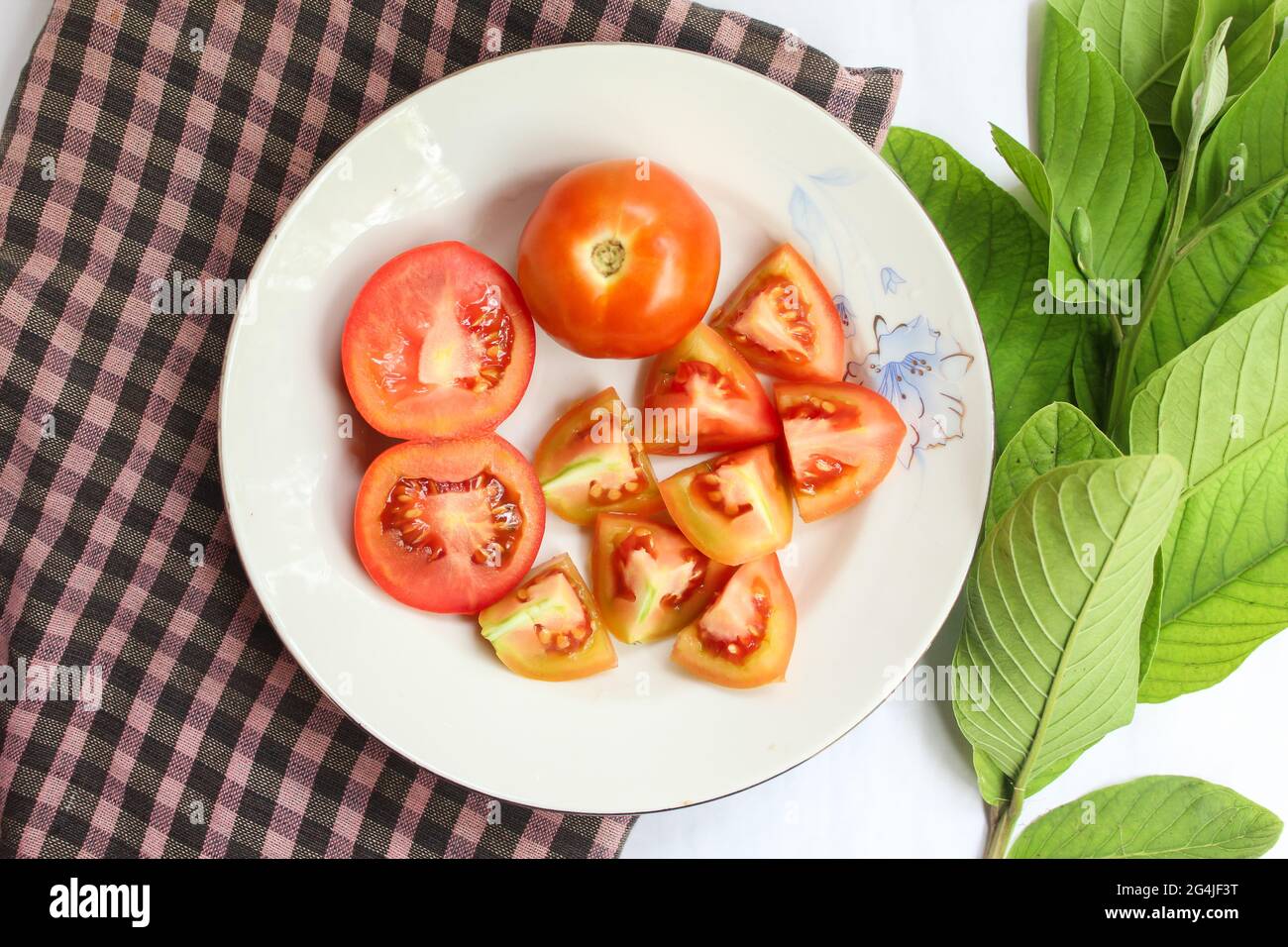 Fresh sliced tomatoes on white plate, taste tomato for eating, food ...