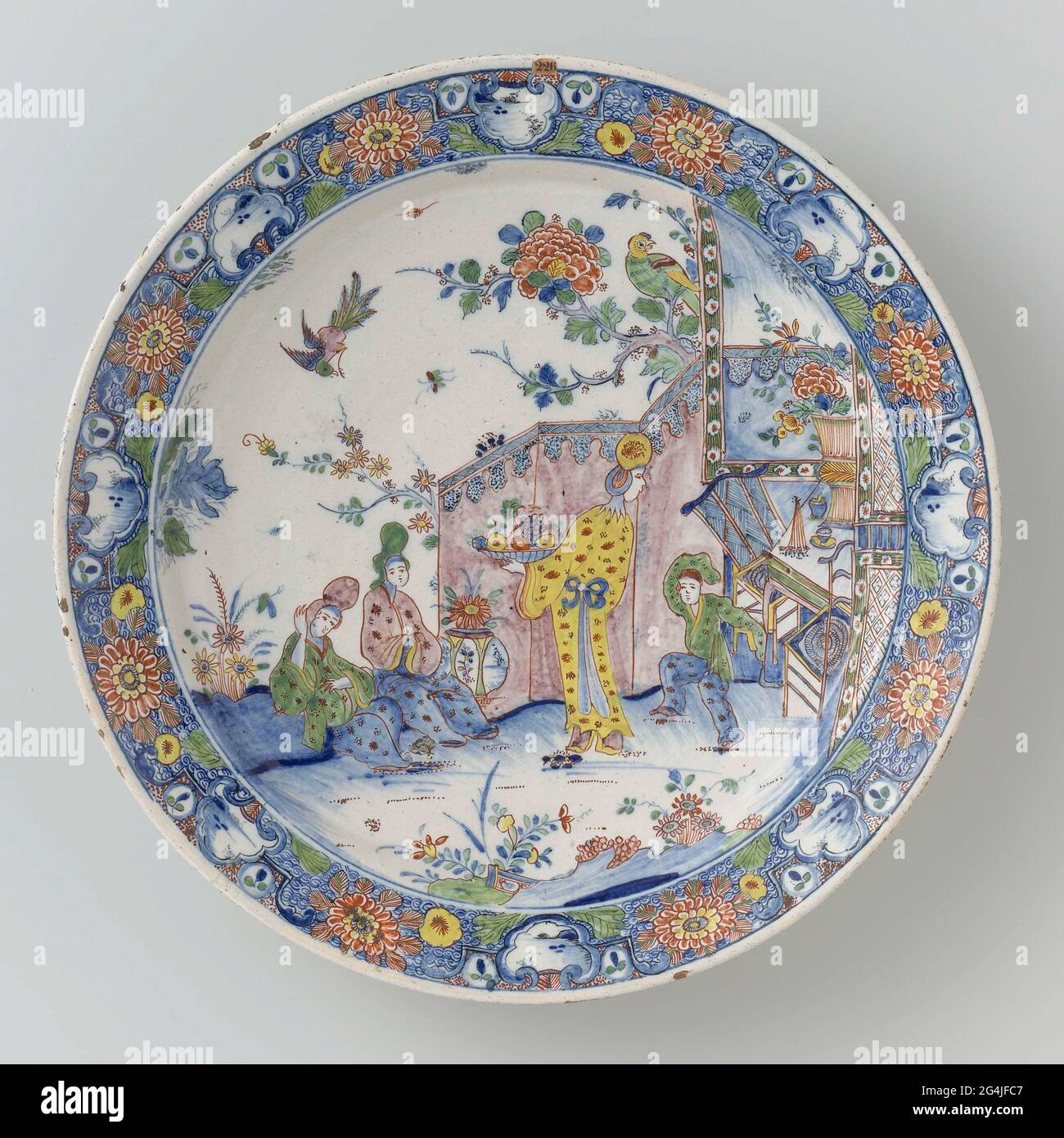. Dish of Faïence, painted multi-colored with four Chinese figures ...