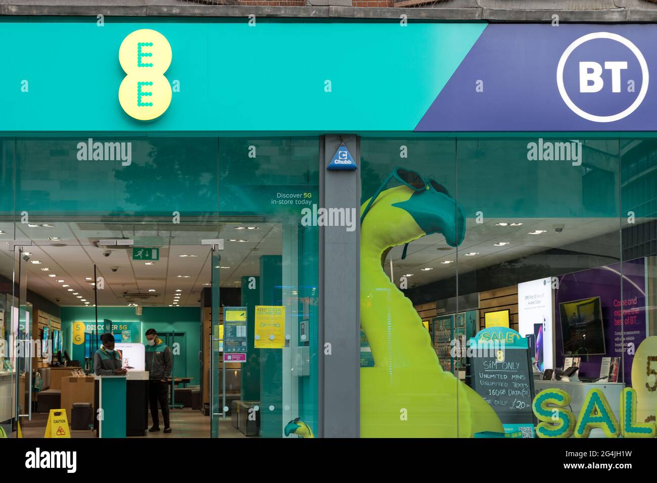 EE logo is seen at one of their stores on Oxford Street in London ...