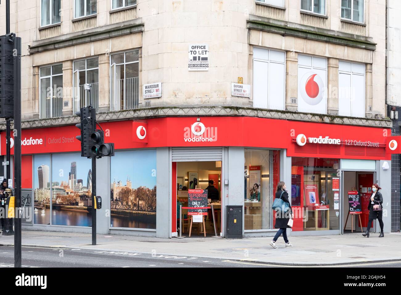 Vodafone logo is seen at one of their stores on Oxford Street in London ...