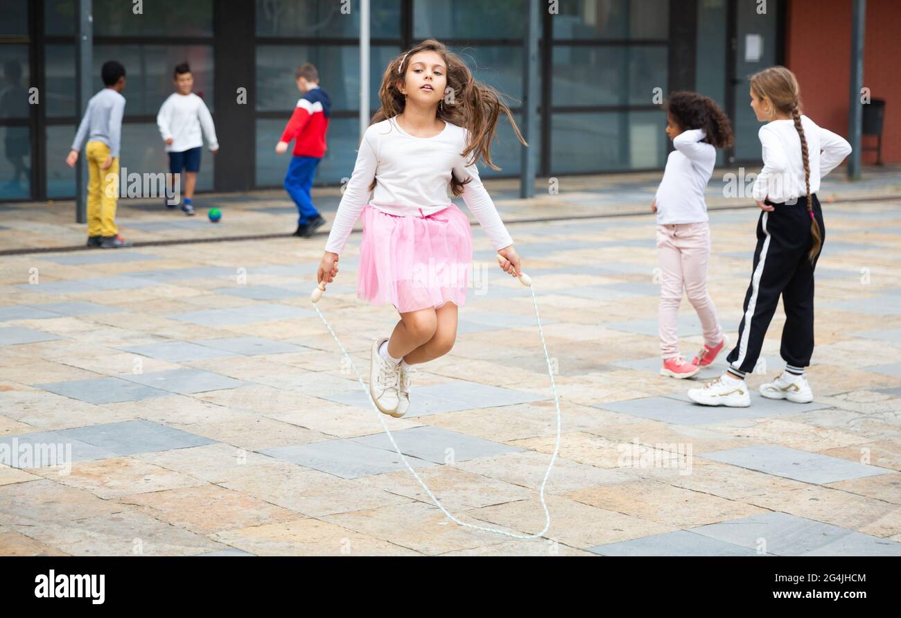 Girl 8 9 jumping rope hi-res stock photography and images - Alamy