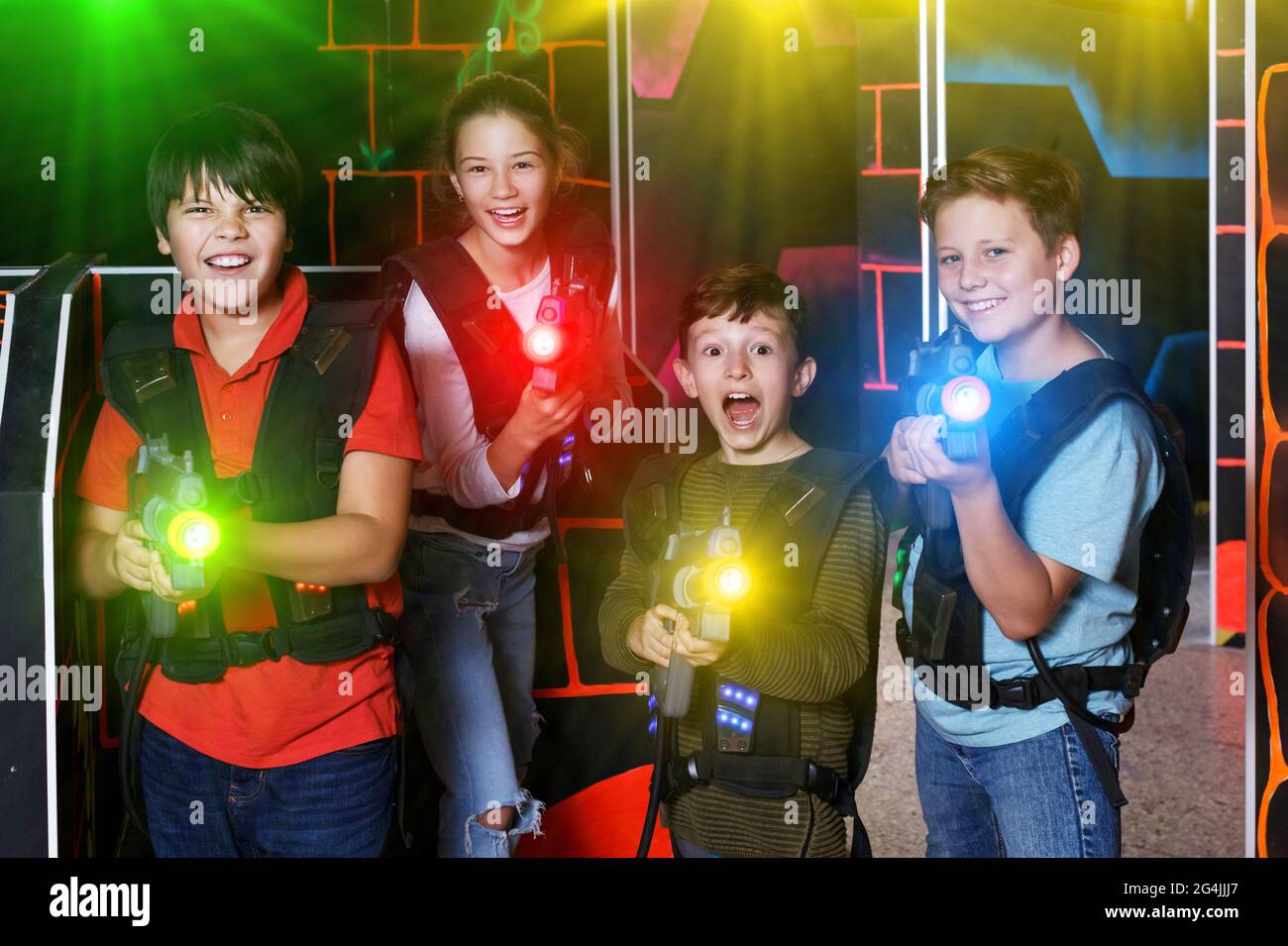 teen kids with laser guns during lasertag game Stock Photo - Alamy