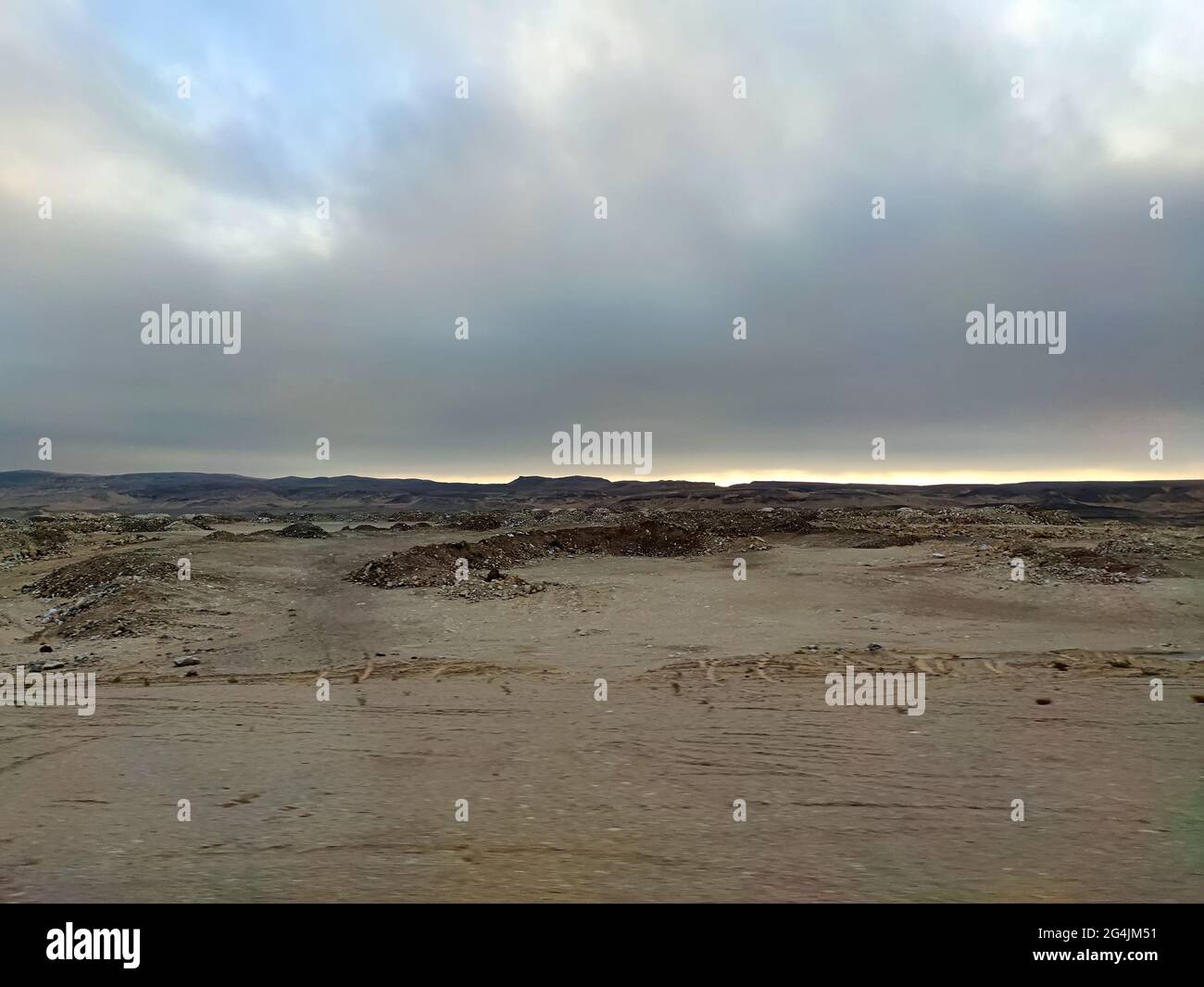 cloudy sunset in the lut desert. evening in the desert Stock Photo - Alamy